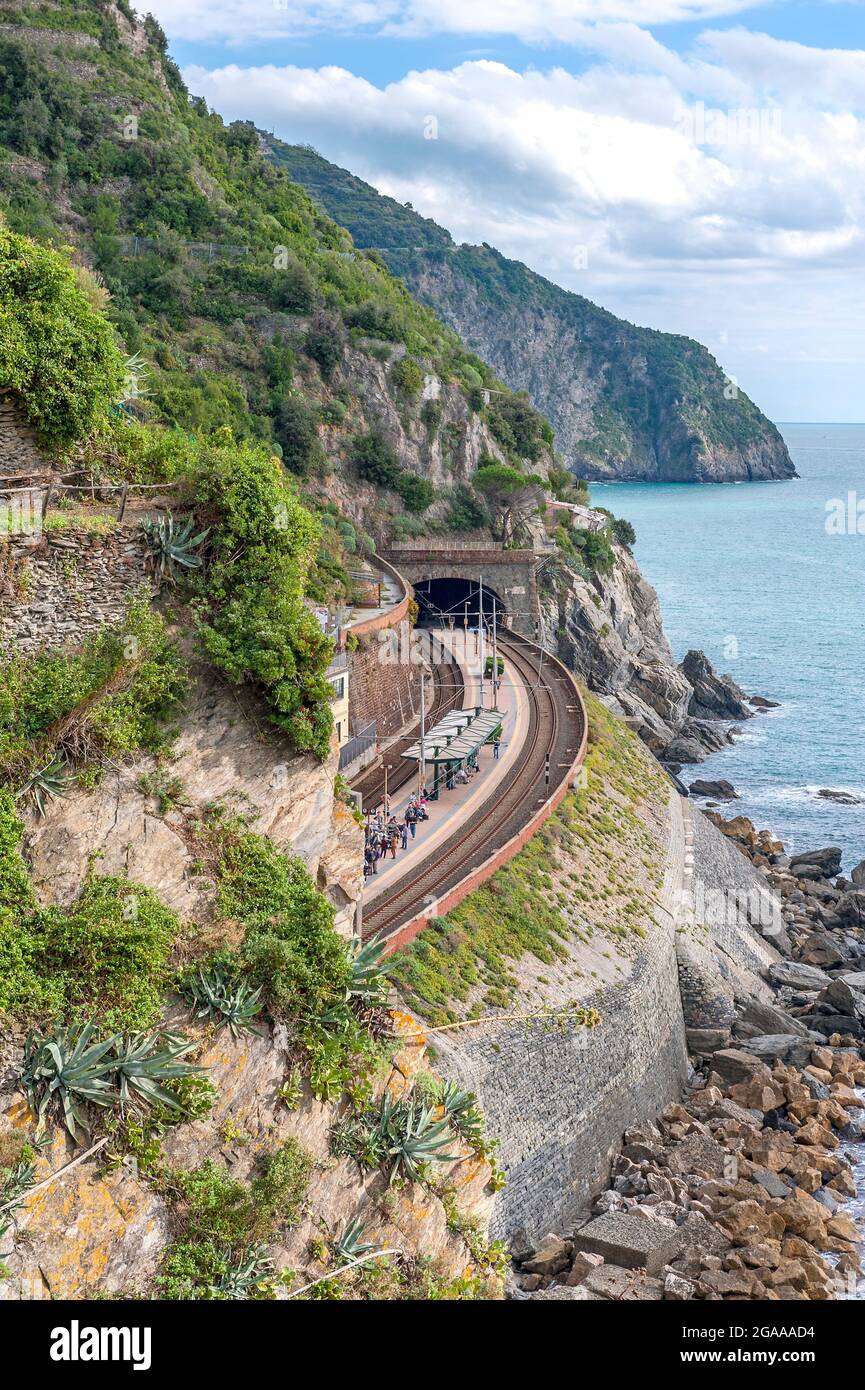 Train station next to the ocean and at the bottom of a mountain Stock ...