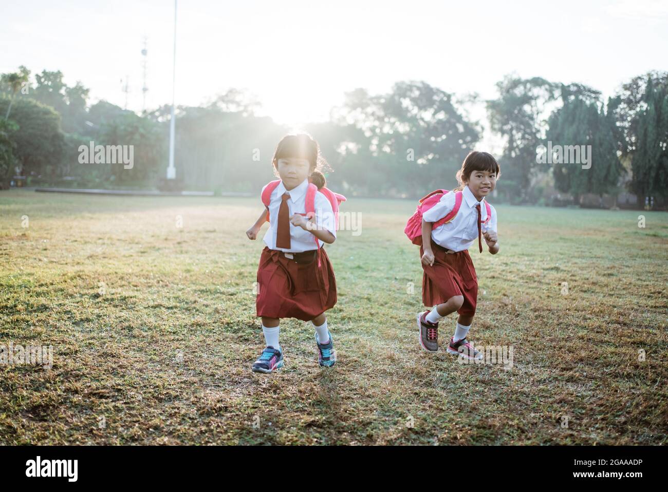 little girl student running together while going to their school Stock ...