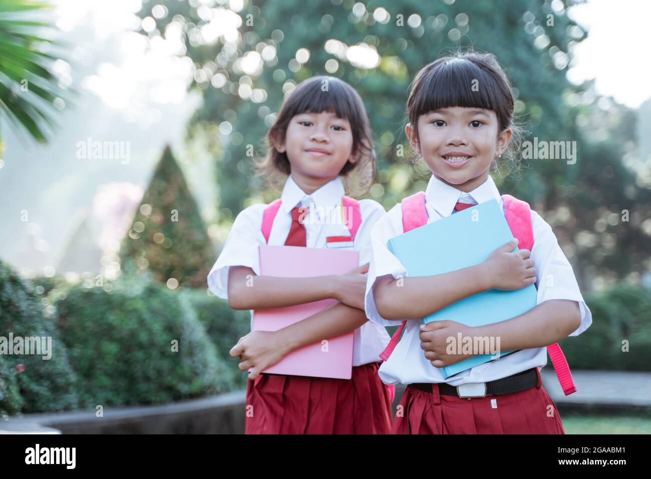 happy student friend in uniform smiling to camera Stock Photo - Alamy
