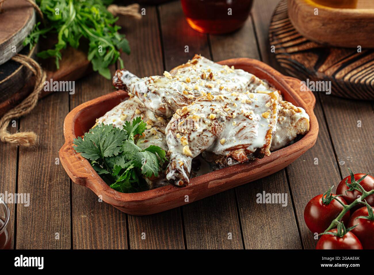 Georgian dish chkmeruli chicken with cream Stock Photo - Alamy