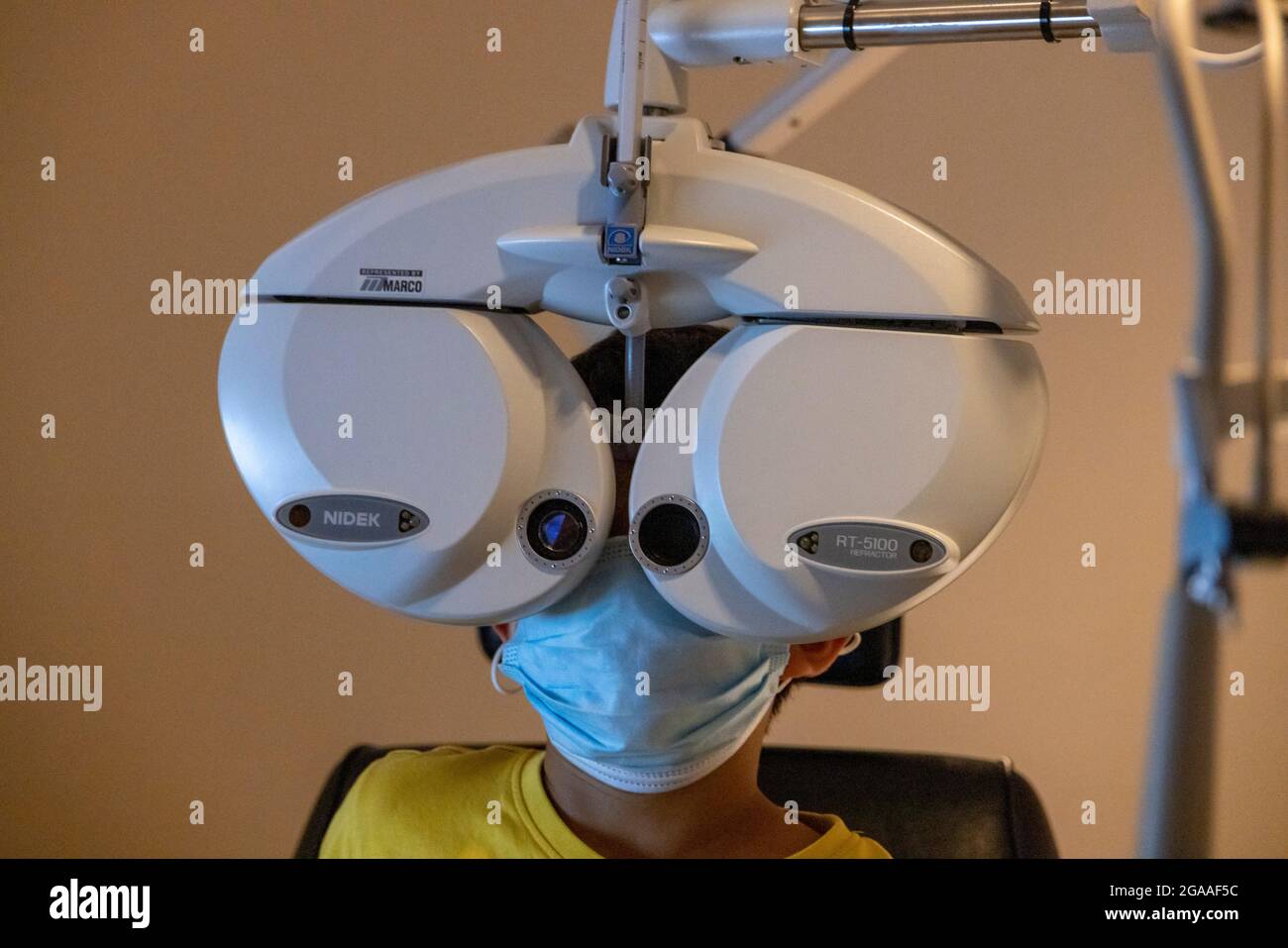 Boy getting eye exam at optometrist's office, USA Stock Photo - Alamy