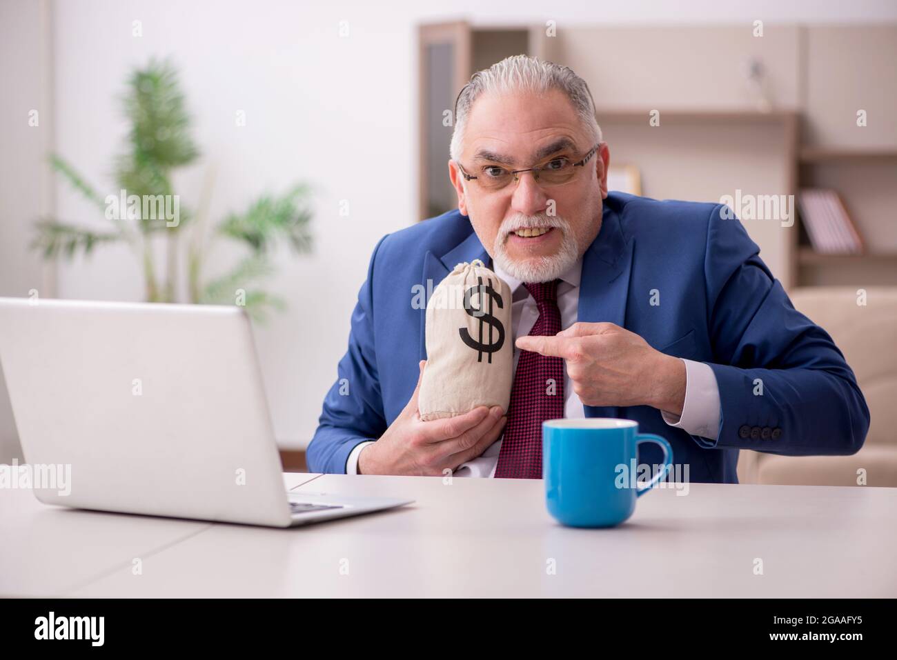 Old employee working from home during pandemic Stock Photo - Alamy