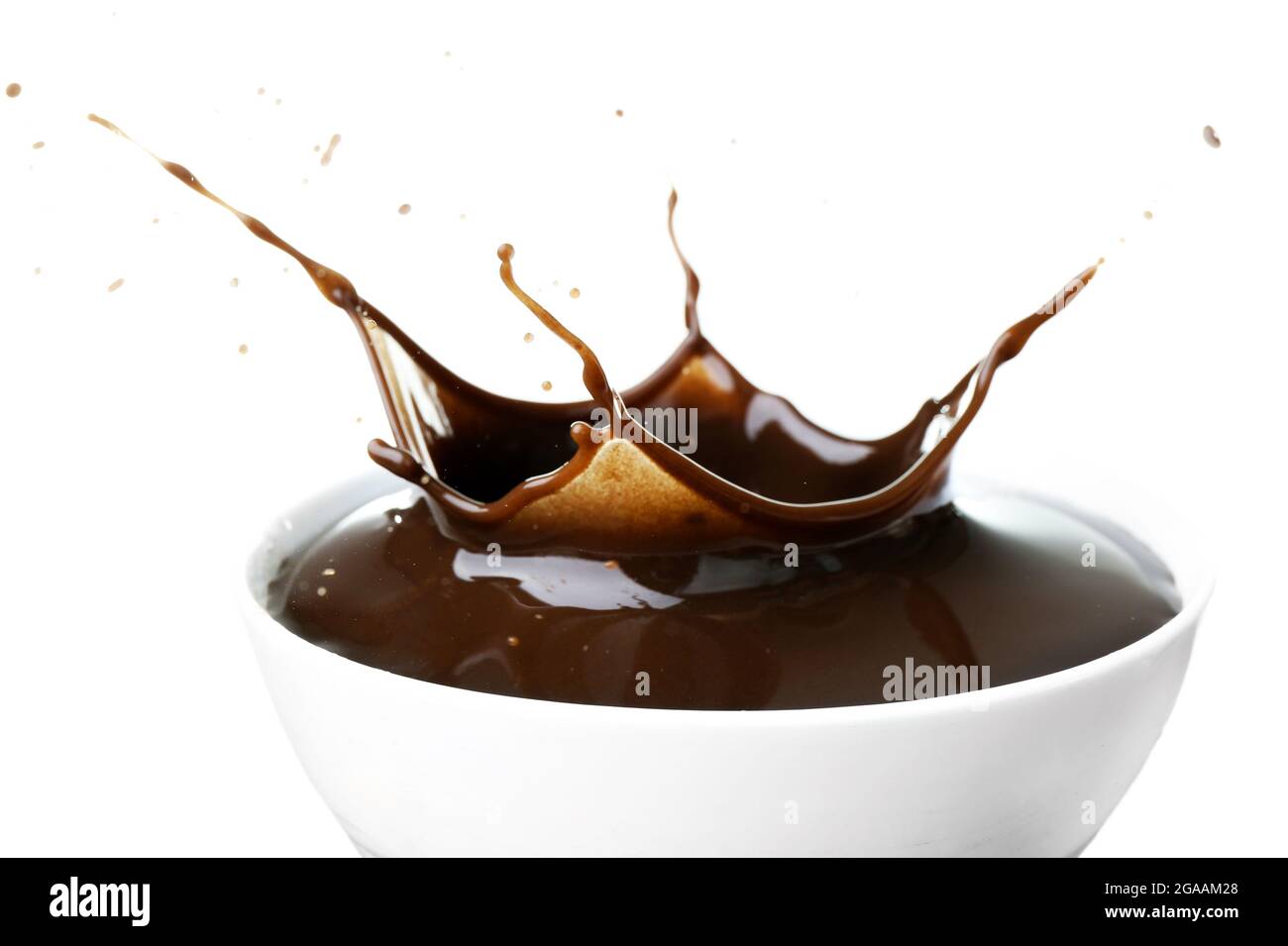 Splash of hot chocolate in cup isolated on white Stock Photo - Alamy