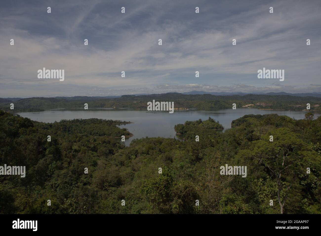 Landscape of Kampar River with hills and forest on its banks is ...