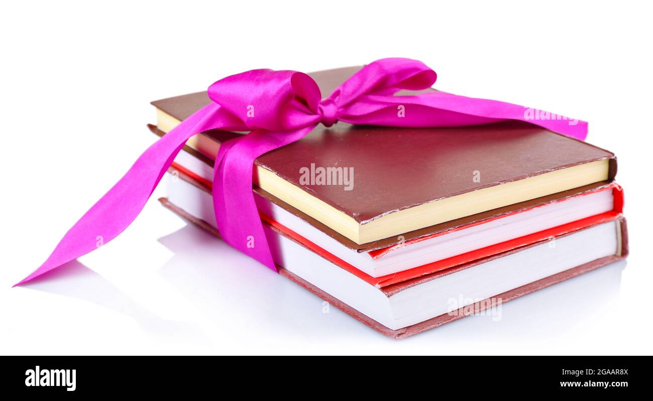 Stack of books with ribbon isolated on white Stock Photo - Alamy