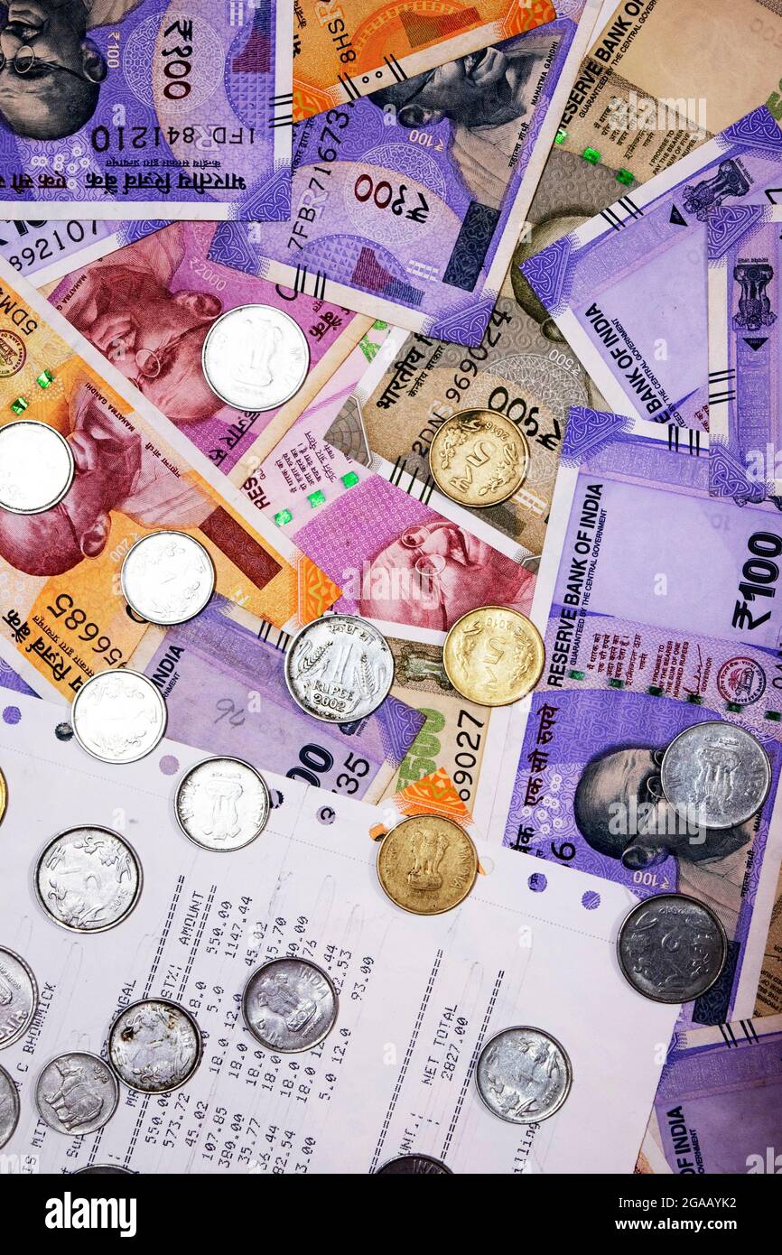 Various Indian paper currency banknotes and coins as a background Stock ...