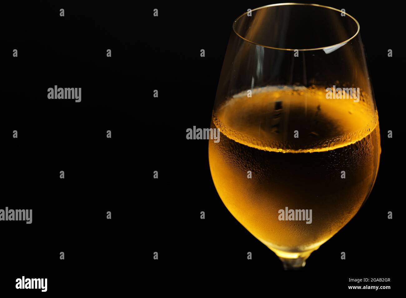 Glass of wine on dark background Stock Photo - Alamy