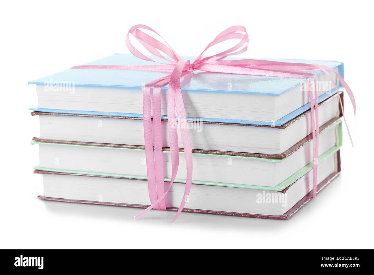 Stack of books with ribbon isolated on white Stock Photo - Alamy
