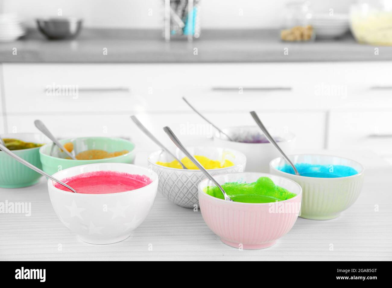 Colorful ingredients in bowls for rainbow cake Stock Photo - Alamy