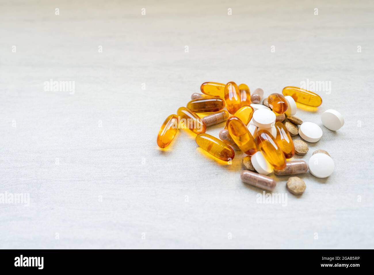 Closeup shot of different tables and capsules isolated on a white ...