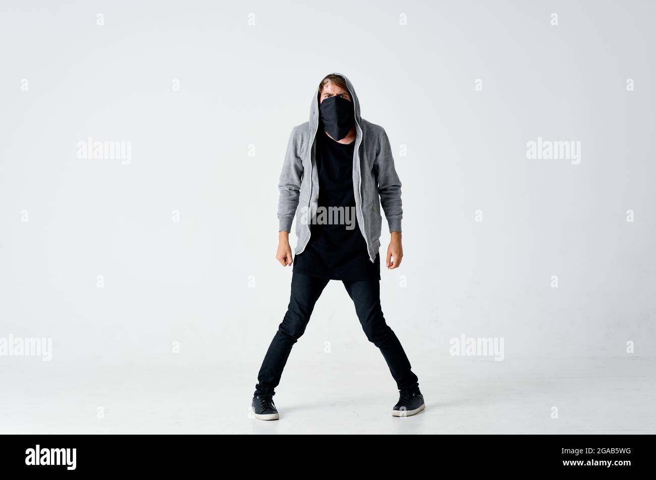 masked man with hood anonymity theft hacking Stock Photo - Alamy
