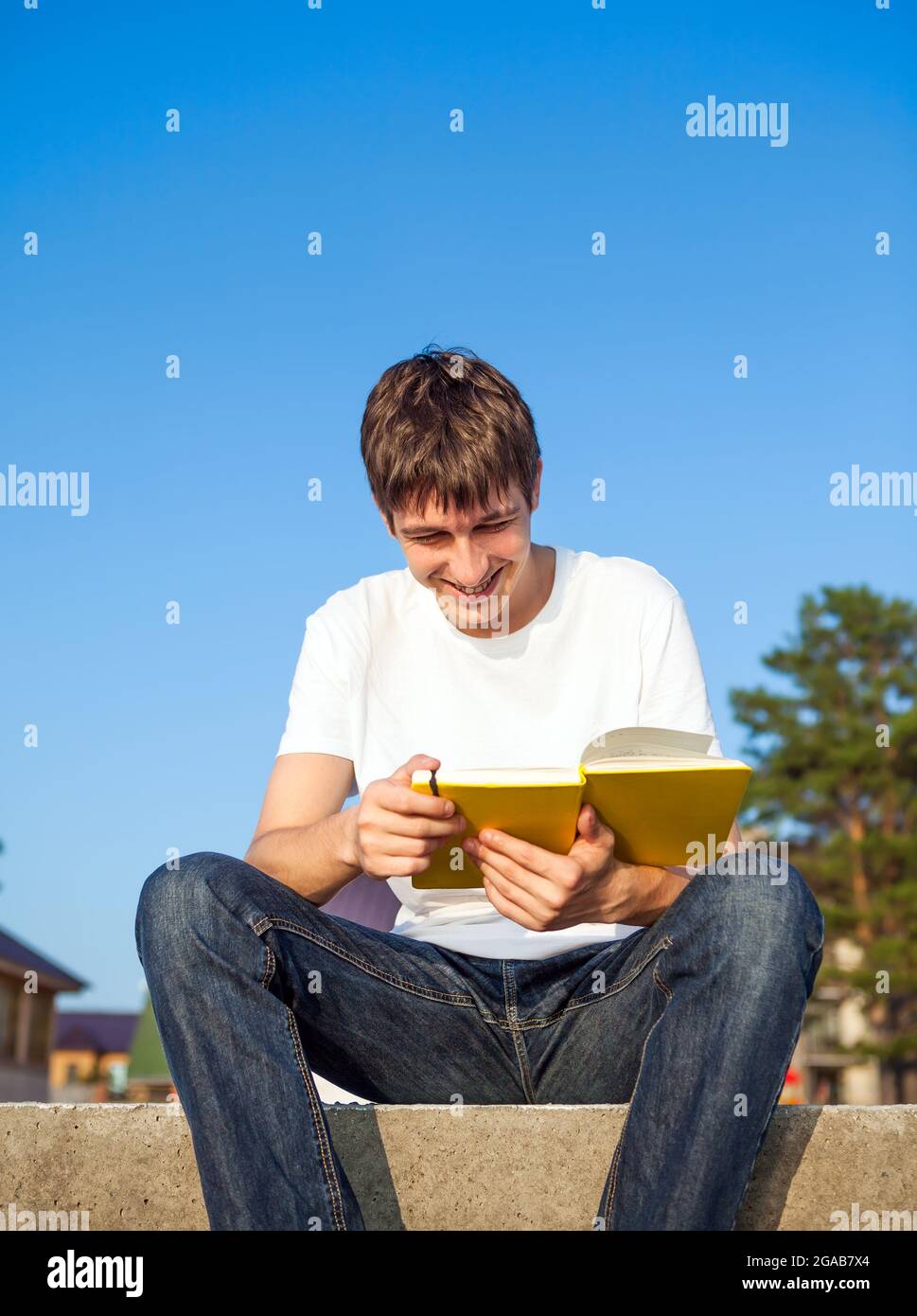 Young guy opened book hi-res stock photography and images - Alamy