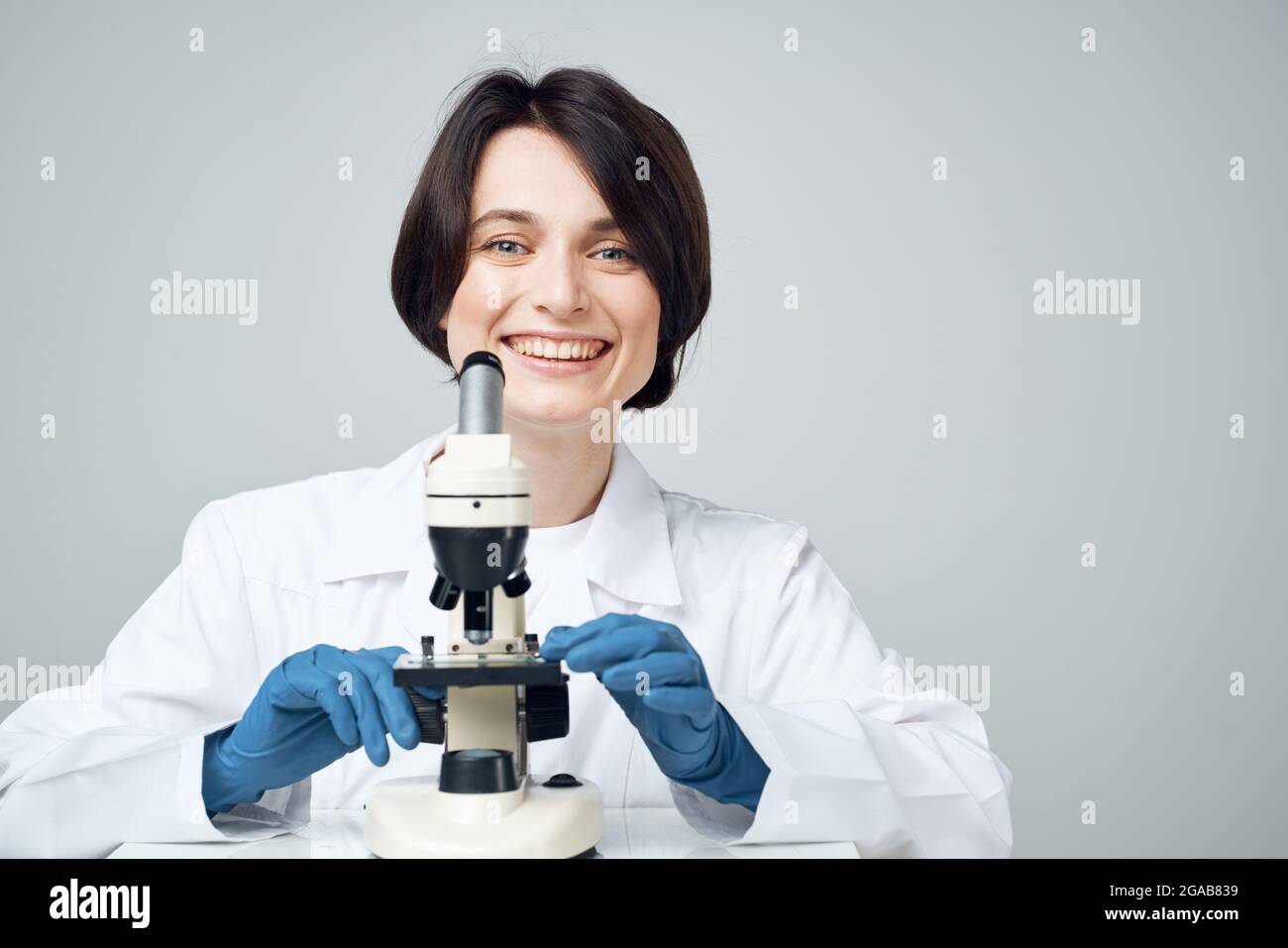 doctor laboratory assistant microscope on research table smile Stock ...