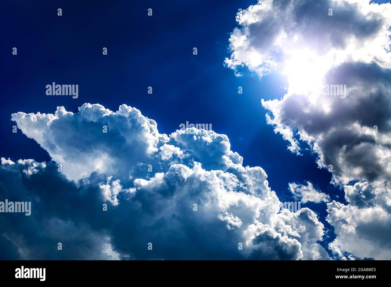 Dramatic Cloudscape Background with Sun and Blue Sky Stock Photo - Alamy