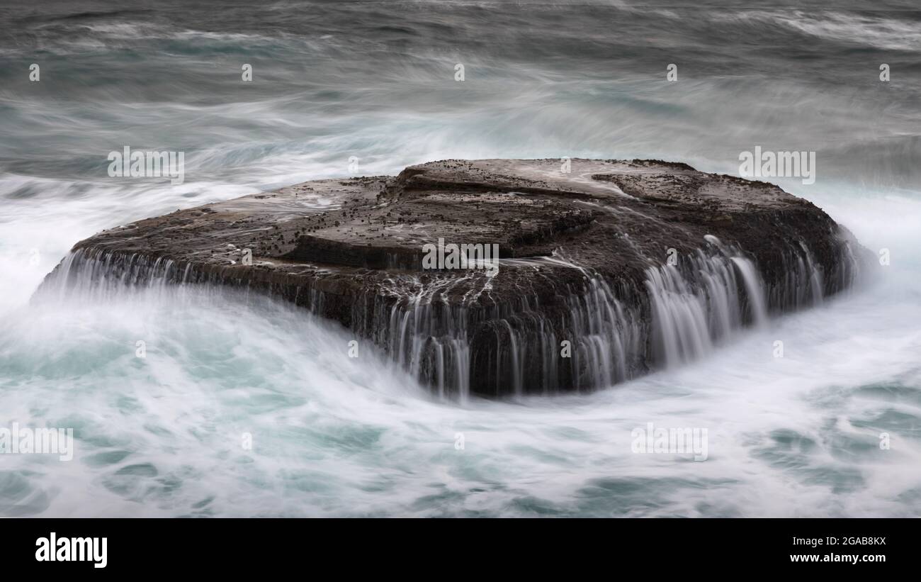 Water flowing into a rock hi-res stock photography and images - Alamy