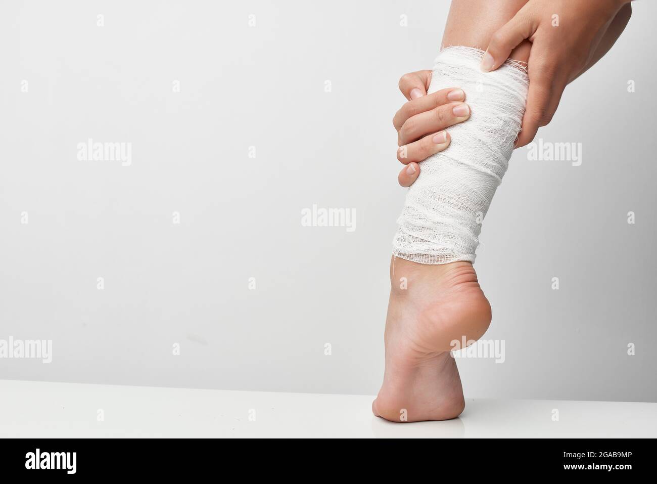 bandaged leg injury close-up health problems Stock Photo - Alamy