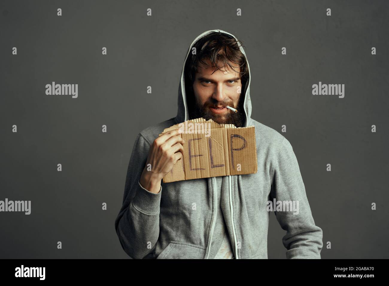 homeless man with beard emotions beggar Stock Photo - Alamy