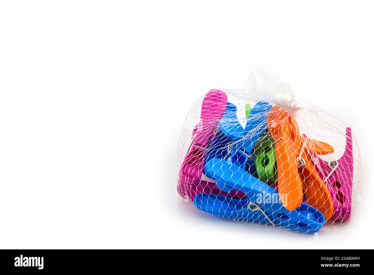 colorful plastic clothes pegs on white background Stock Photo - Alamy