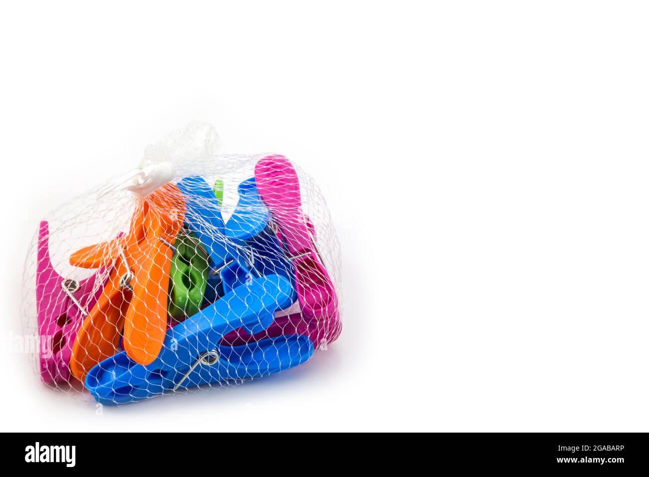 colorful plastic clothes pegs on white background Stock Photo - Alamy