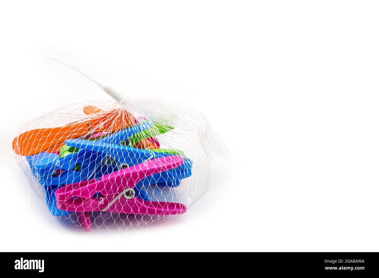 colorful plastic clothes pegs on white background Stock Photo - Alamy
