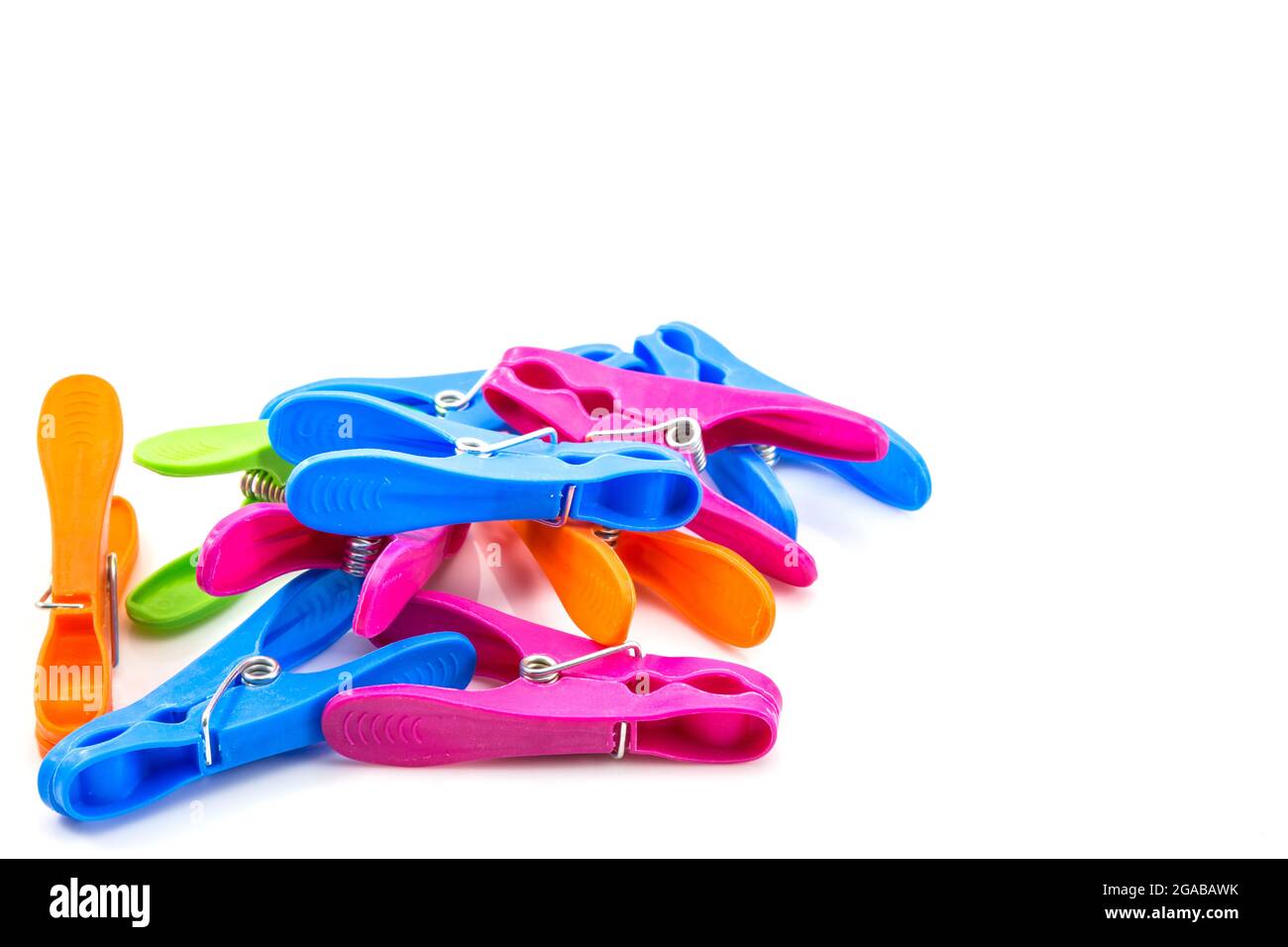 colorful plastic clothes pegs on white background Stock Photo - Alamy