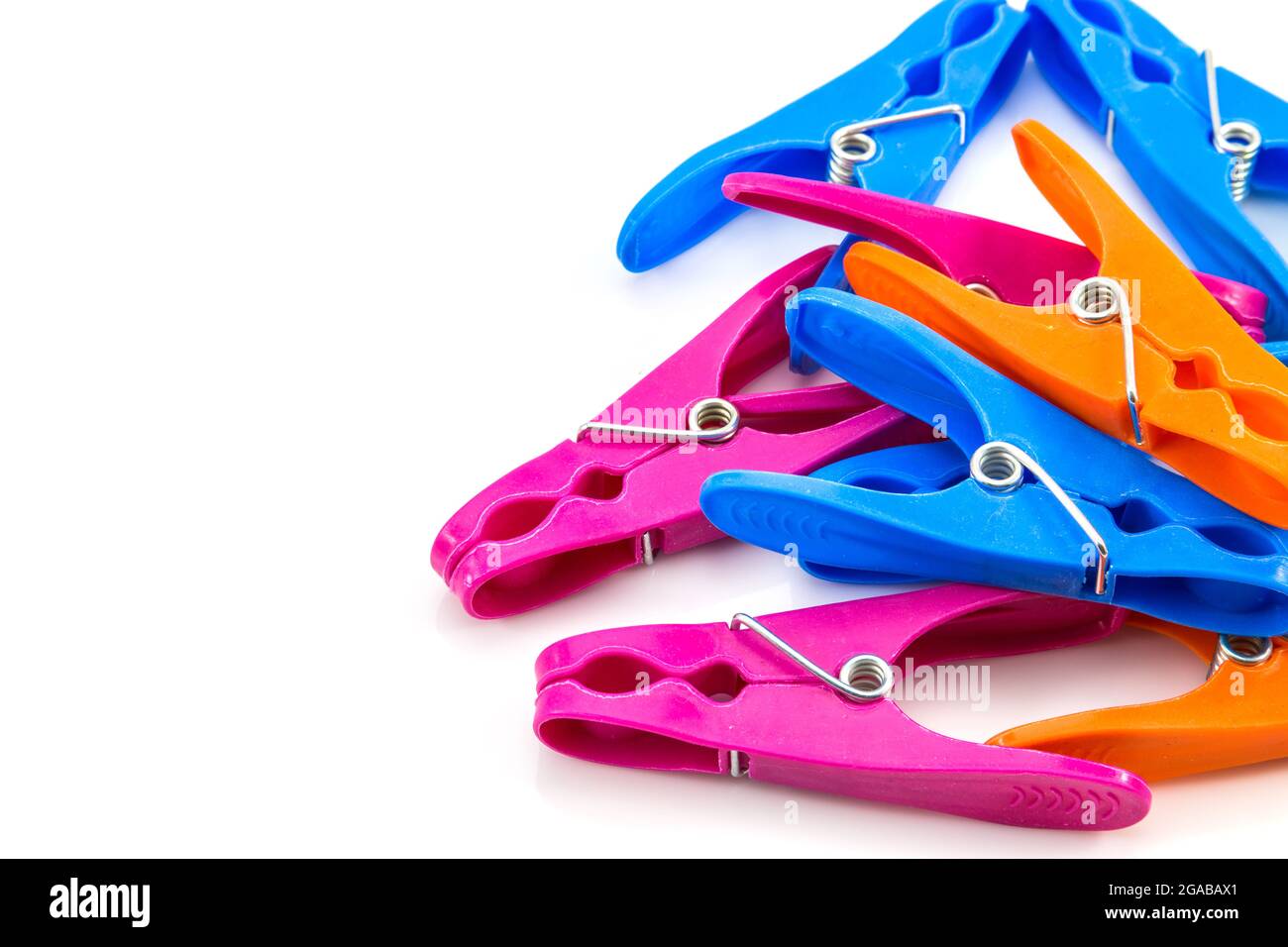 colorful plastic clothes pegs on white background Stock Photo - Alamy