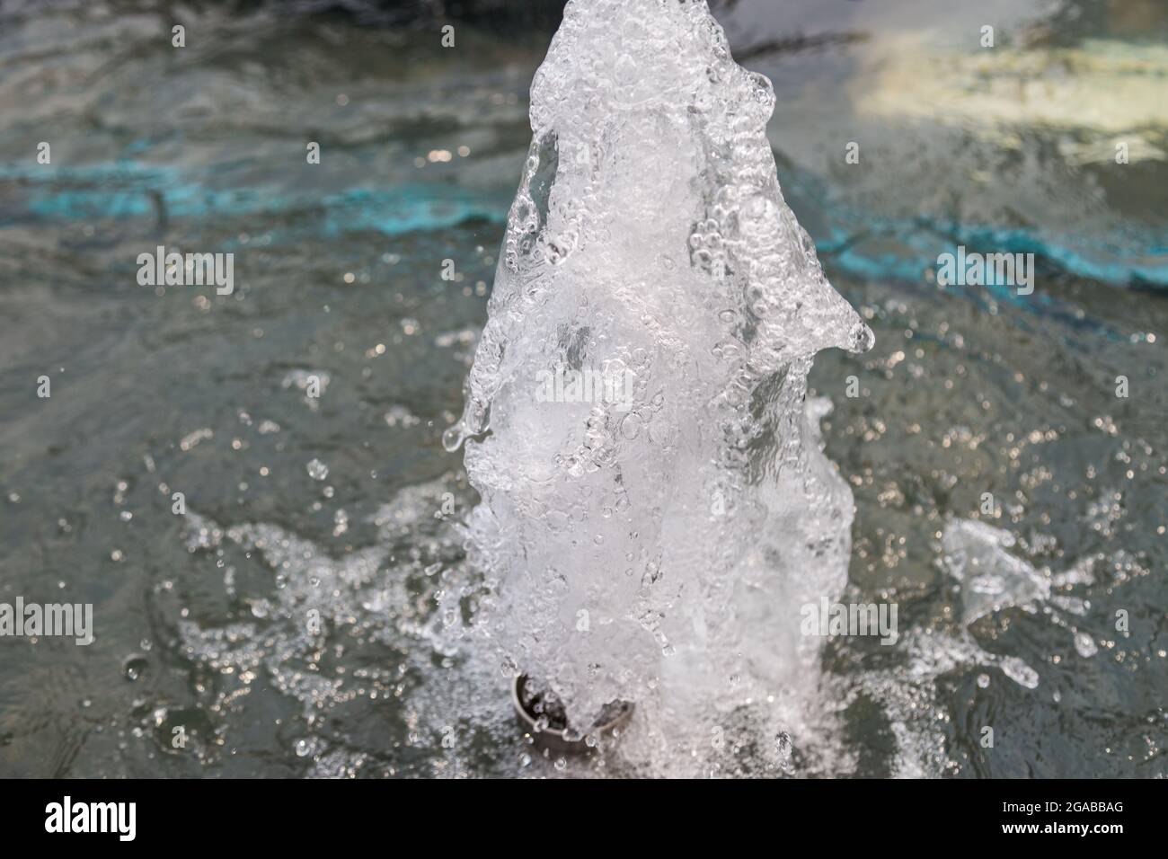 Water stream splashing on the pool background Stock Photo - Alamy
