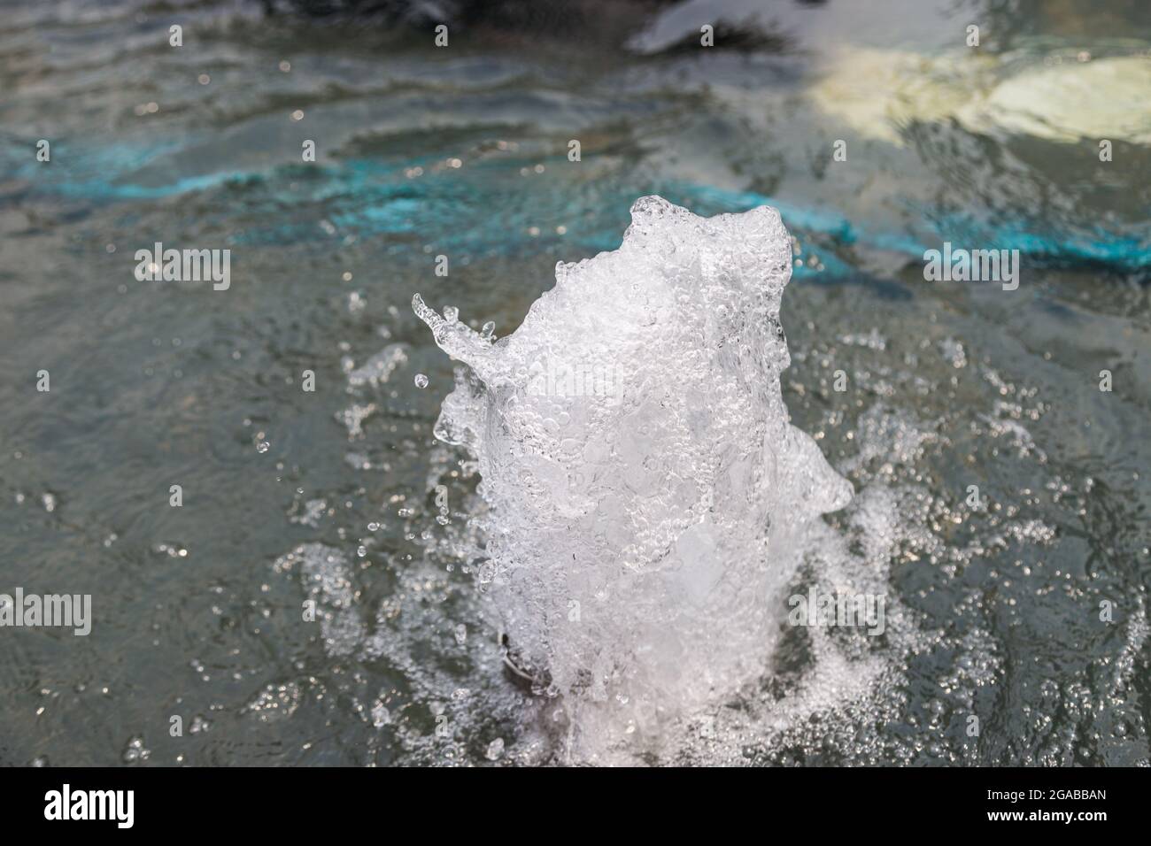 Water stream splashing on the pool background Stock Photo - Alamy