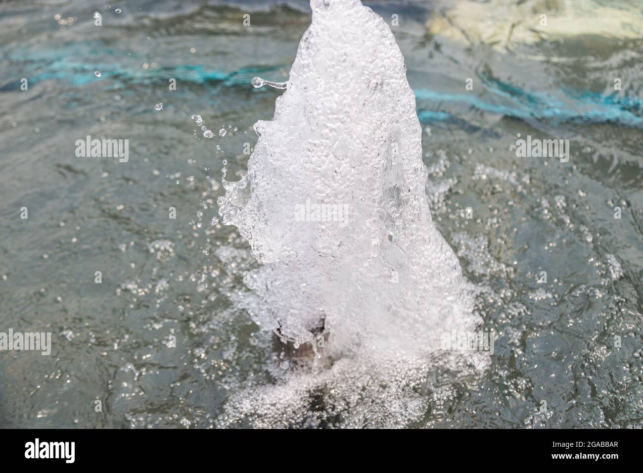 Water stream splashing on the pool background Stock Photo - Alamy