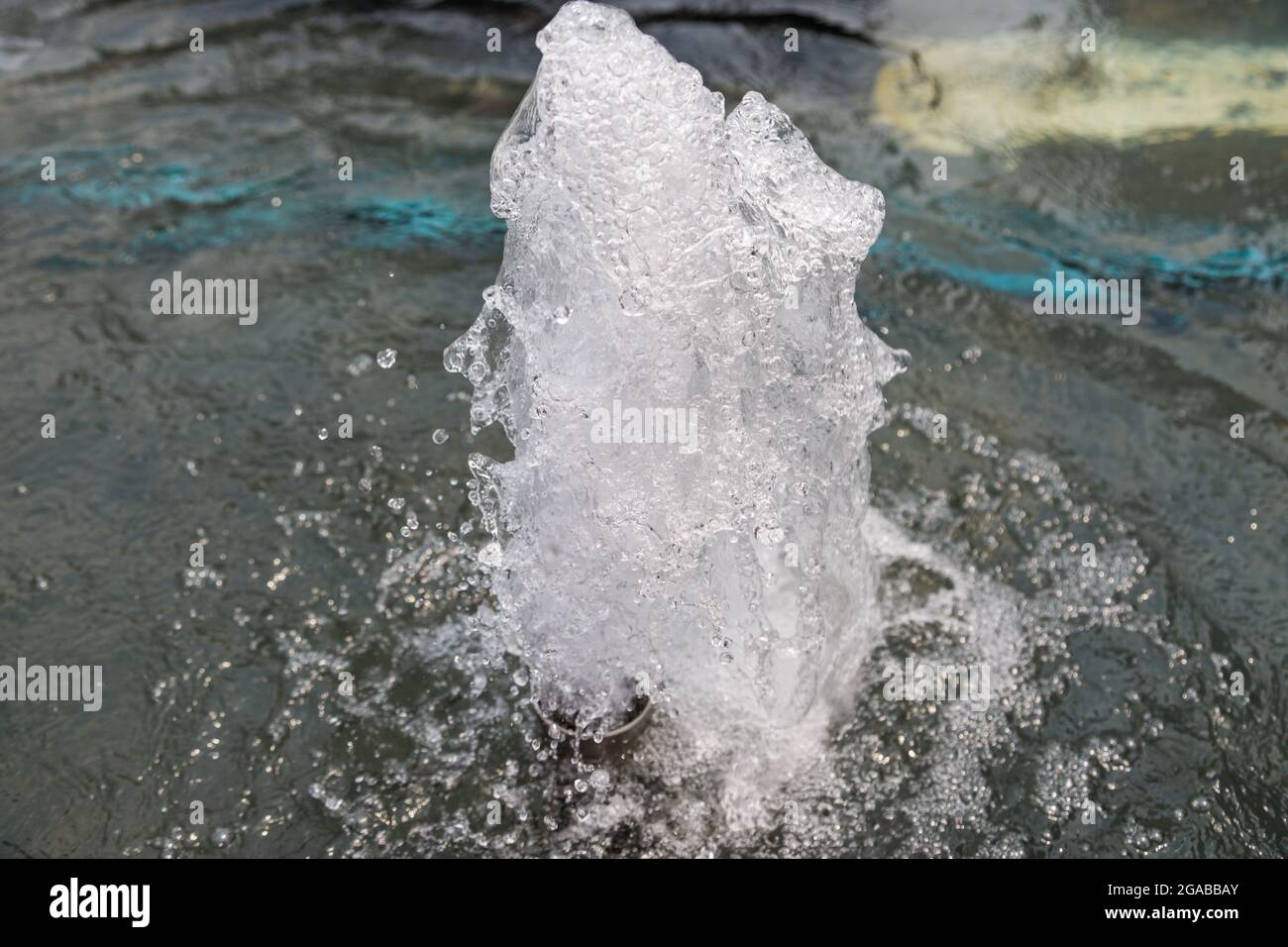 Water stream splashing on the pool background Stock Photo - Alamy