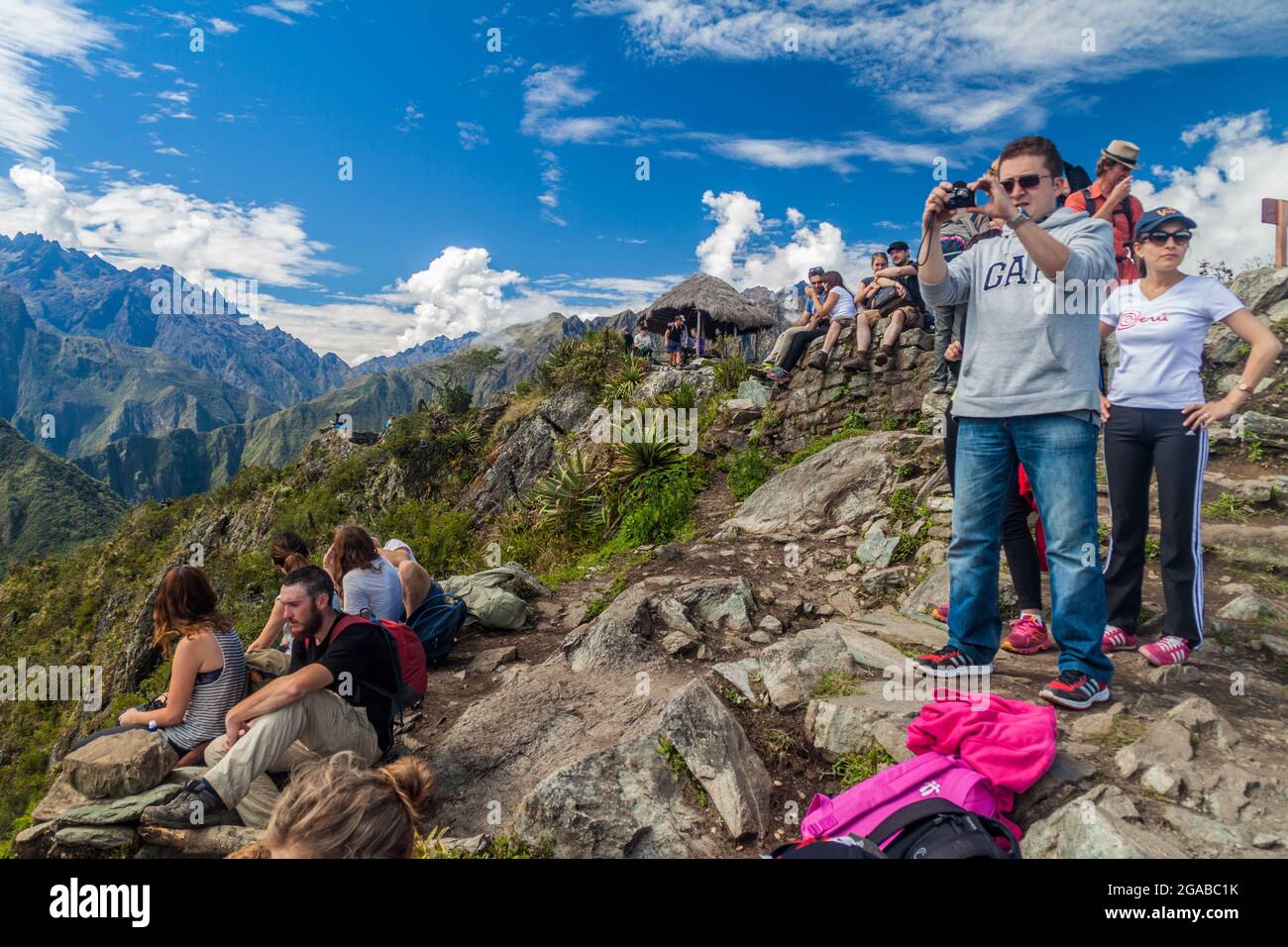 MACHU PICCHU, PERU - MAY 18, 2015: Tourists at the peak of Machu Picchu ...