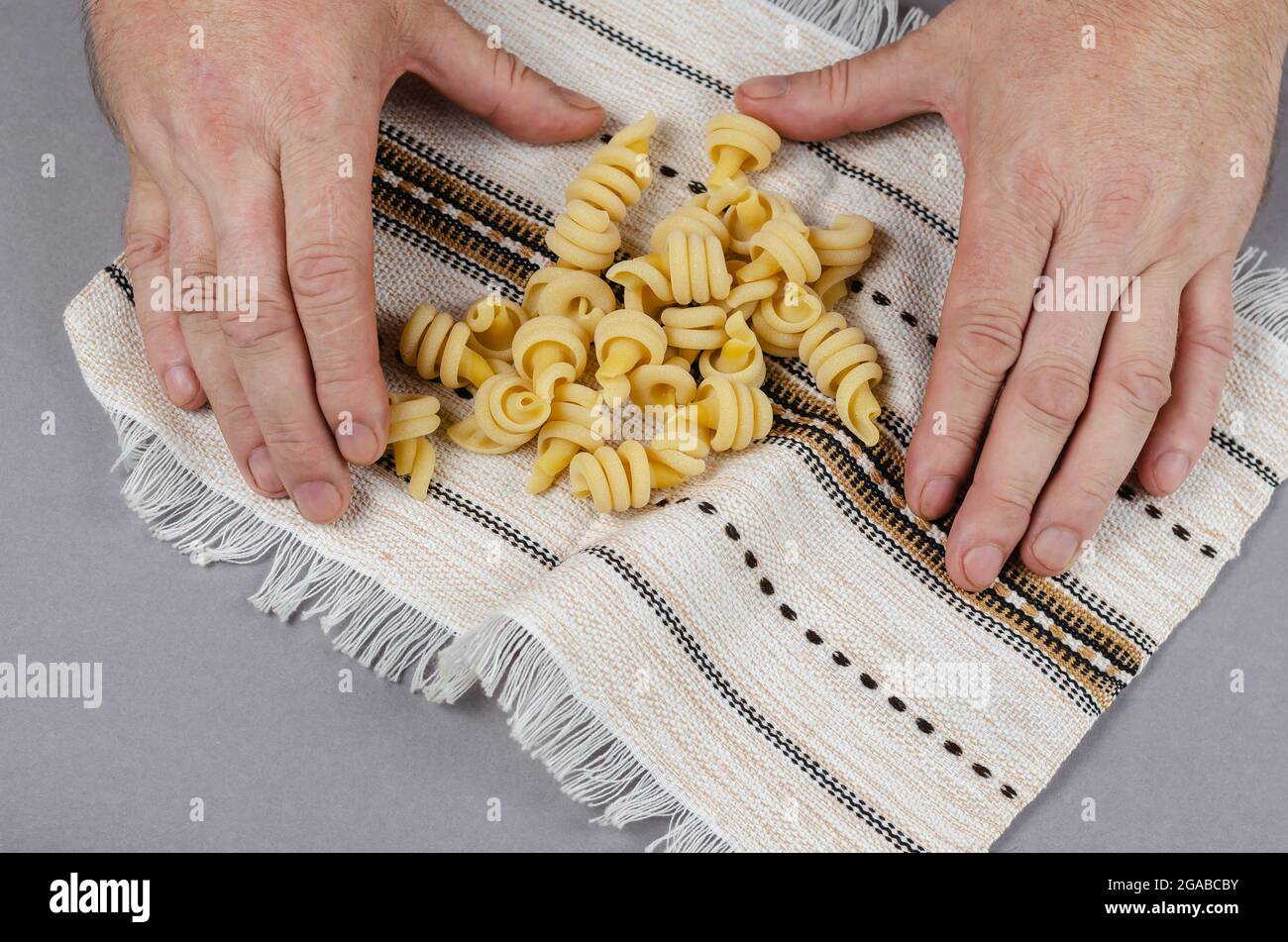 Nodi marini, insalatonde pasta. A portion of pasta on a white ethnic ...