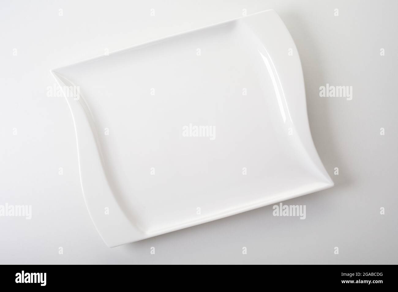 From above creative ceramic plate of square shape with wavy edges ...