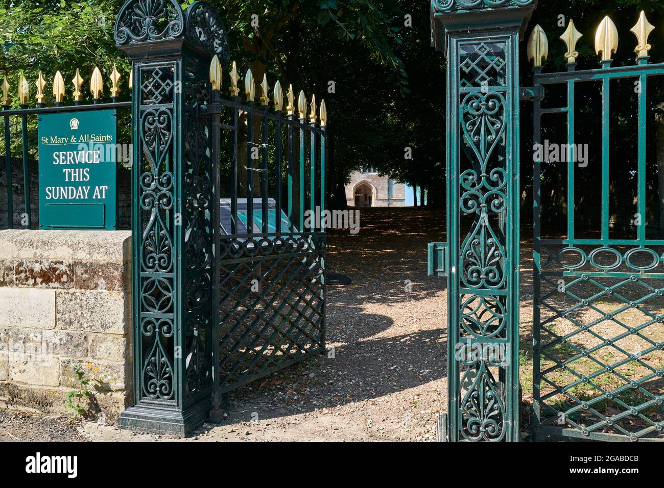 The entrance gate and tree lined avenue to St Mary and All Saints 15th ...