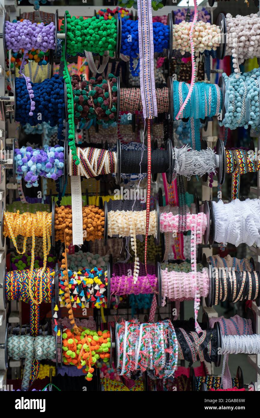 Variety of colorful rolls of beads at the market Stock Photo - Alamy