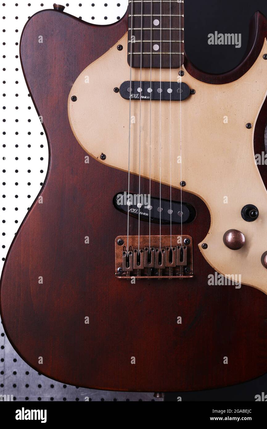 Guitar strings on metal grid background Stock Photo - Alamy
