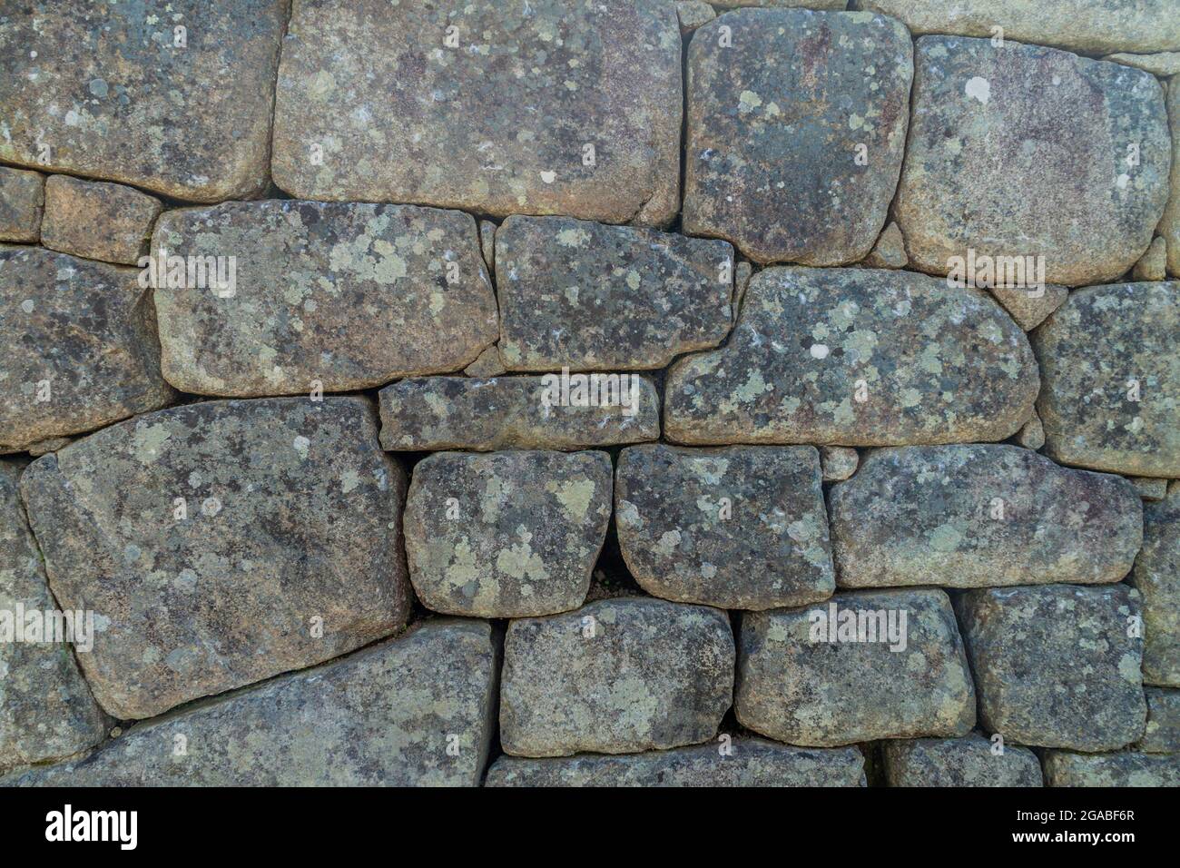 Detail of a stone wall of an agricultural terrace at Machu Picchu ruins ...