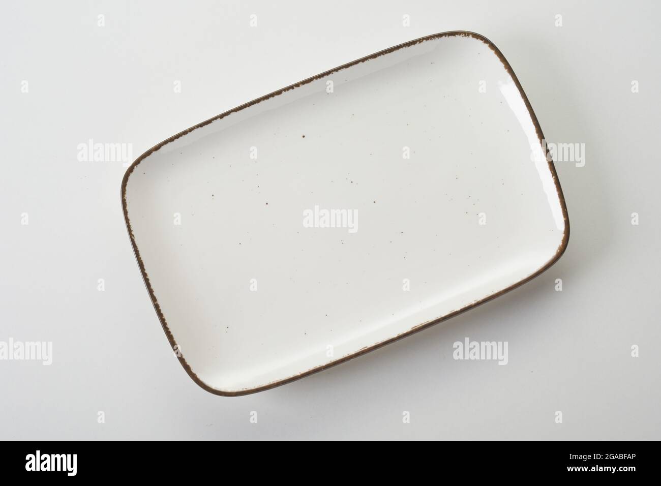 Top view of empty rectangular shaped white ceramic serving platter with ...