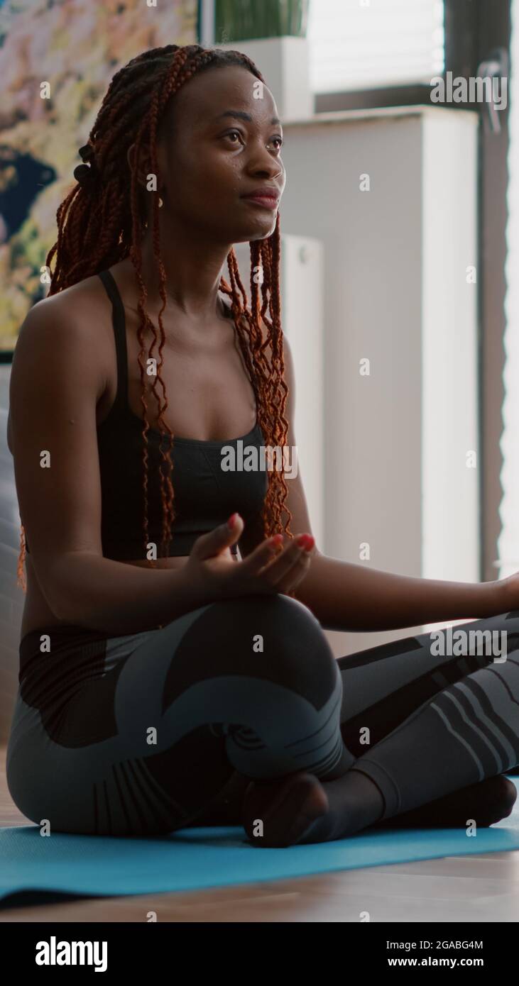 Flexible black athlete relaxing in hi-res stock photography and images ...