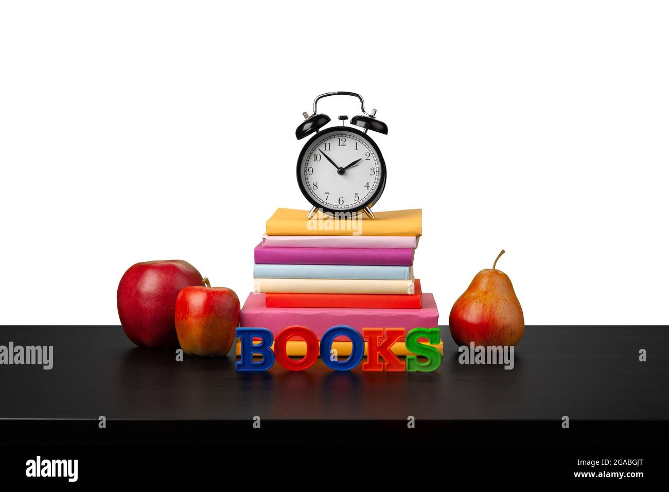 Stack of books and alarm clock, time to read concept Stock Photo - Alamy