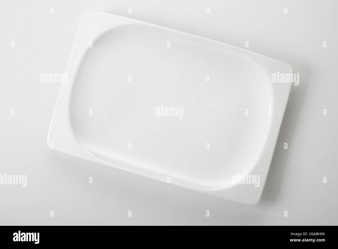 Top view of empty white rectangular shaped ceramic serving platter on ...