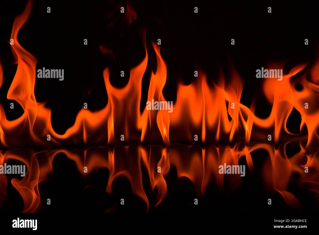 Red Fire flames on black background Stock Photo - Alamy
