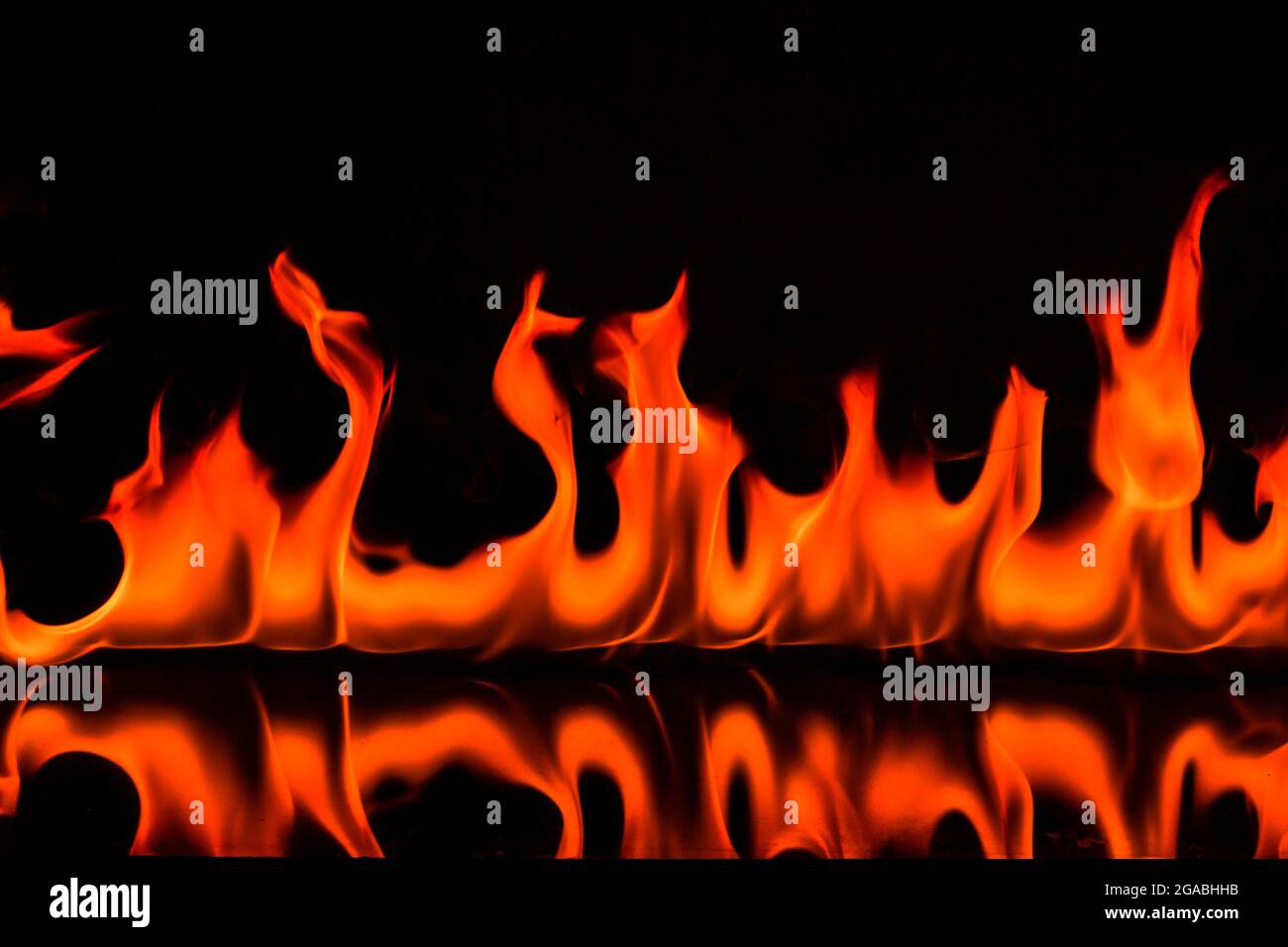 Red Fire flames on black background Stock Photo - Alamy