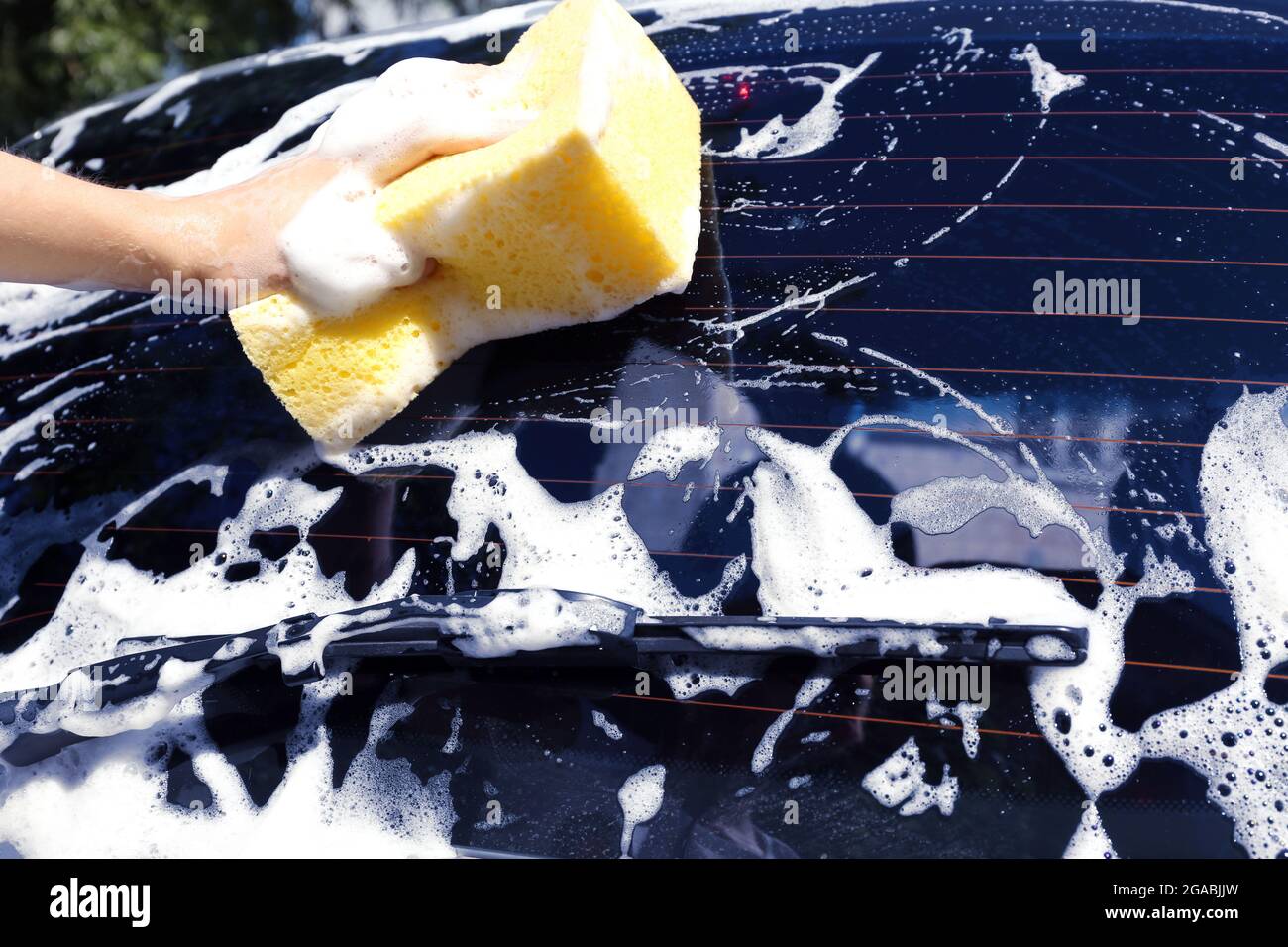 Hand washing car window Stock Photo - Alamy