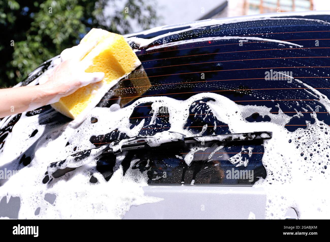Hand washing car window Stock Photo - Alamy
