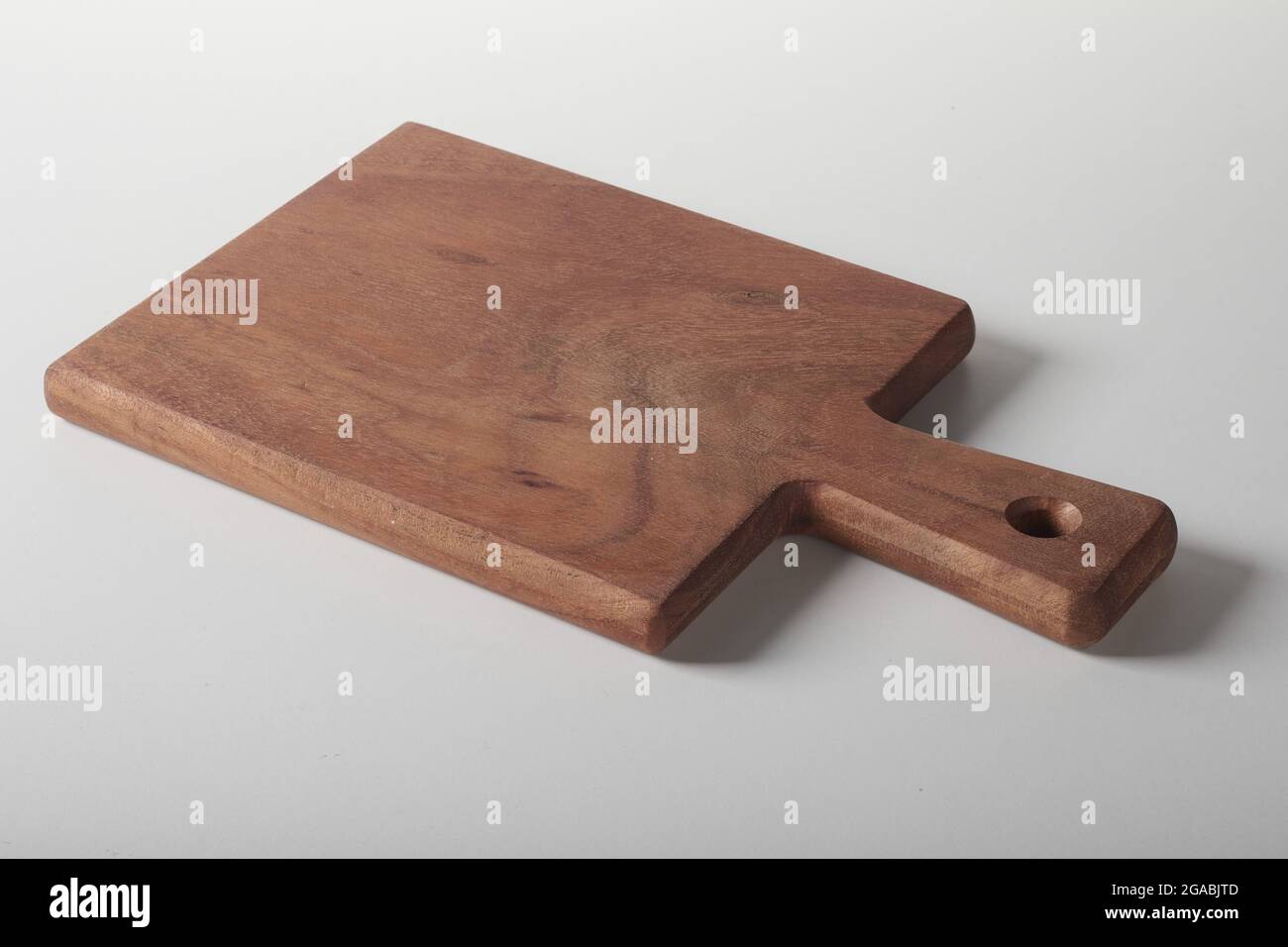 From above of empty wooden kitchen paddle chopping board for serving ...