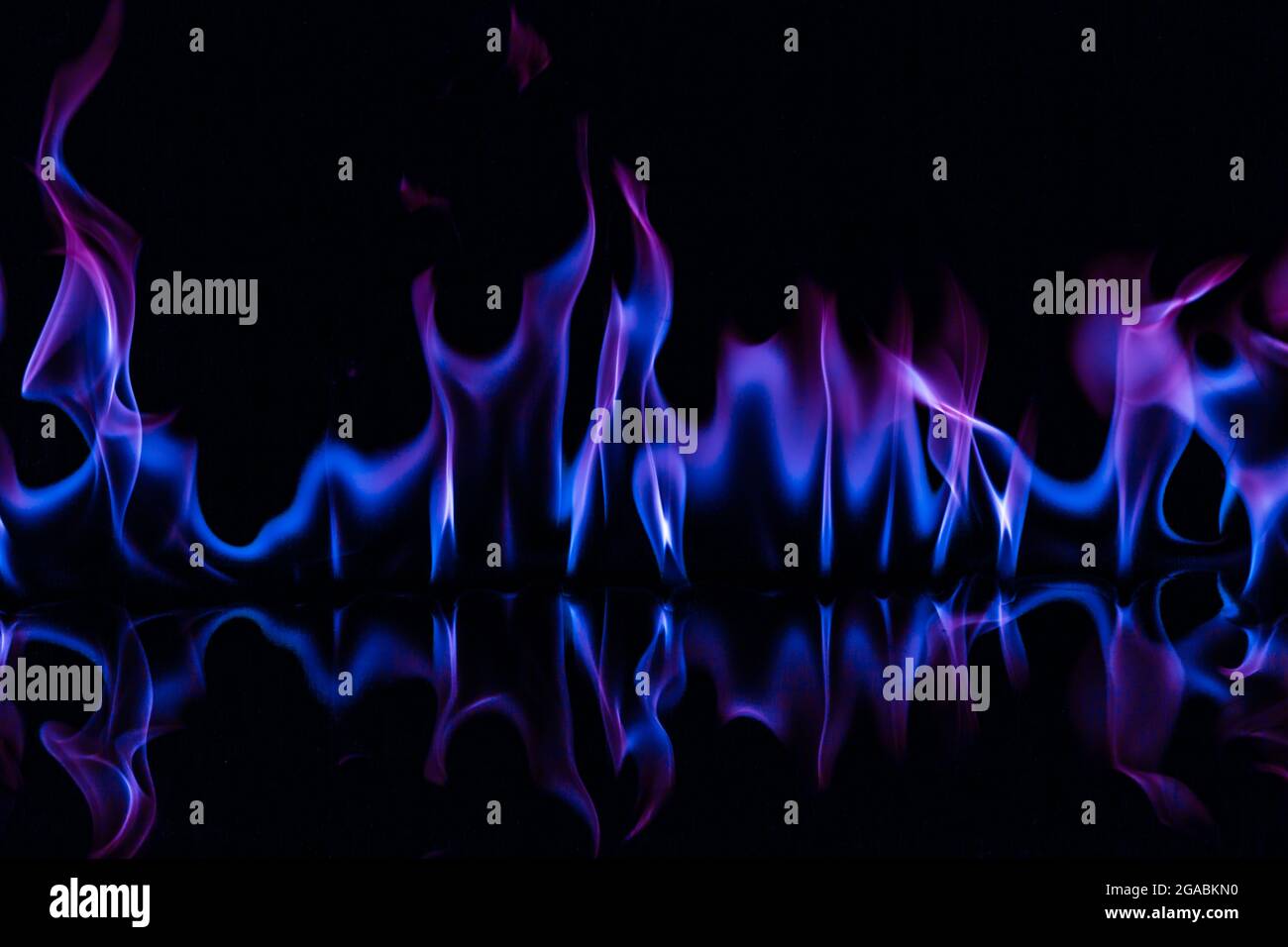 Blue color fire flames on black background Stock Photo - Alamy