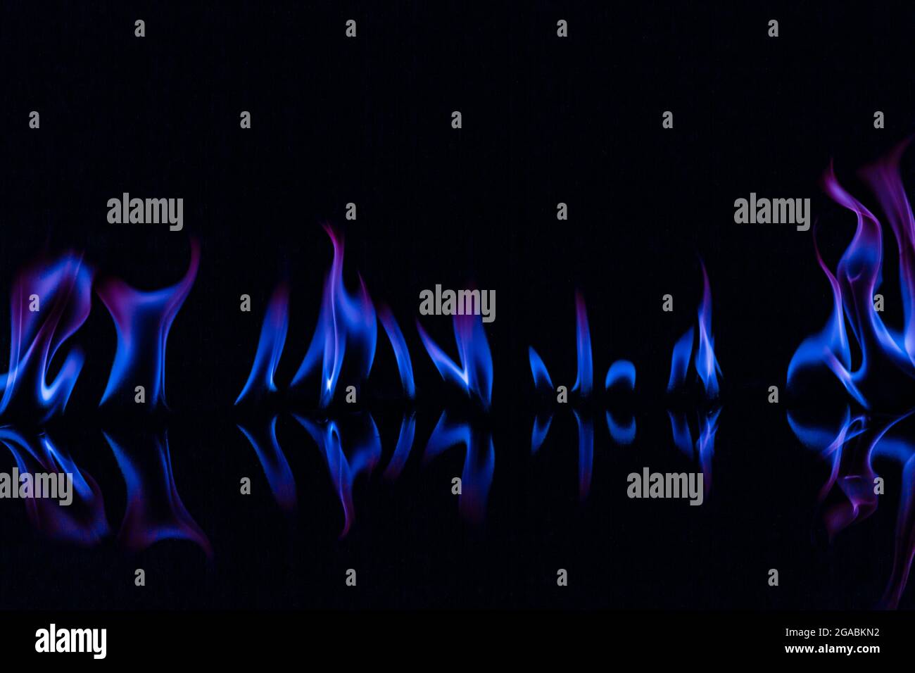 Blue color fire flames on black background Stock Photo - Alamy