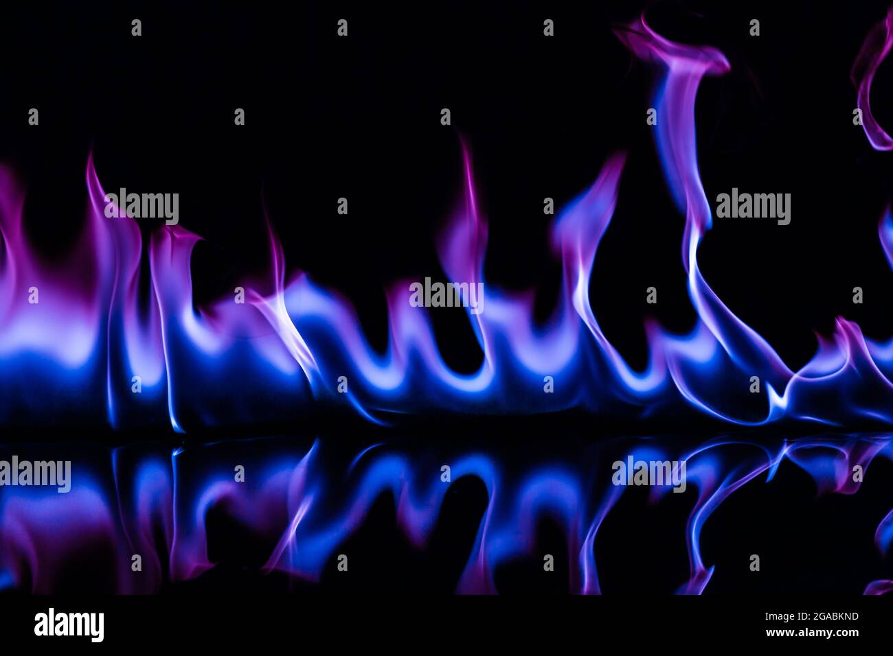 Blue color fire flames on black background Stock Photo - Alamy