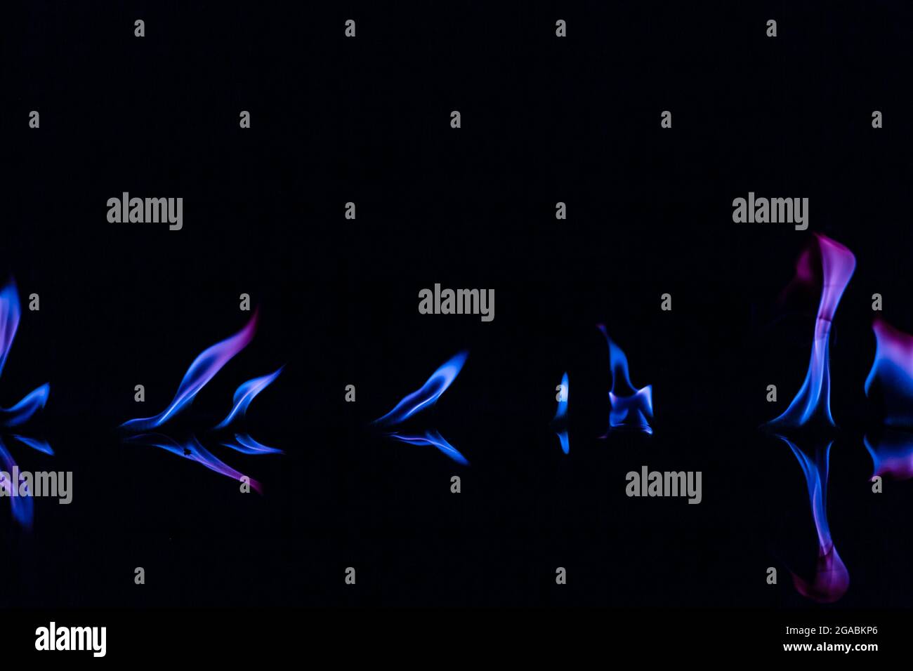 Blue color fire flames on black background Stock Photo - Alamy